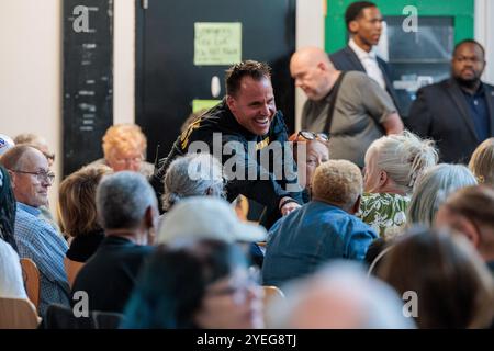Genesee County Sheriff Chris Swanson talks with an inmate at the county ...
