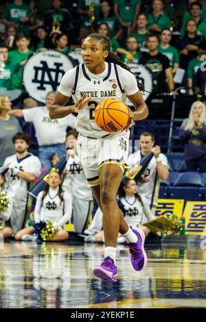 Notre Dame forward Liatu King (20) drives past North Carolina forward ...