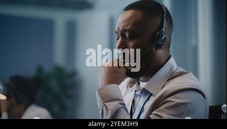 Psychological hotline call center: Close up of African American crisis ...