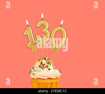 Birthday cupcake with candle number 130 - Blue background Stock Photo ...
