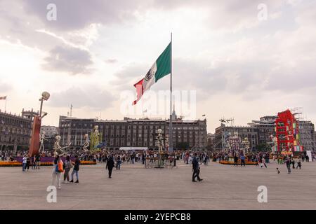 Large Mexican flag flies over Zócalo, surrounded by Day of the Dead ...