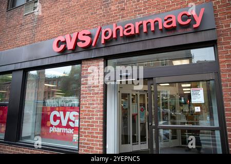 This image shows the storefront of a CVS Pharmacy, with its bold red ...