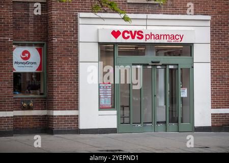 This image shows the storefront of a CVS Pharmacy, with its bold red ...