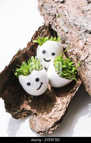 Easter egg shell with greens on gray background. Holiday composition ...