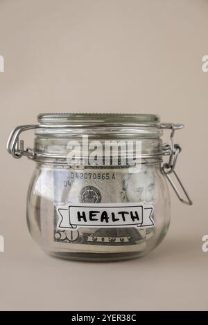Glass jars filled with Dollar bills, savings inside glass jar, money ...