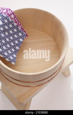 Natural wooden chair, wooden bucket and Japanese hand towel Stock Photo ...