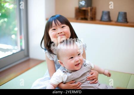 A sister and brother who get on well with each other Stock Photo - Alamy