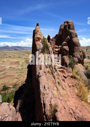 Tourist in the archaeological site of Aramu Muru in Peruvian Andes ...