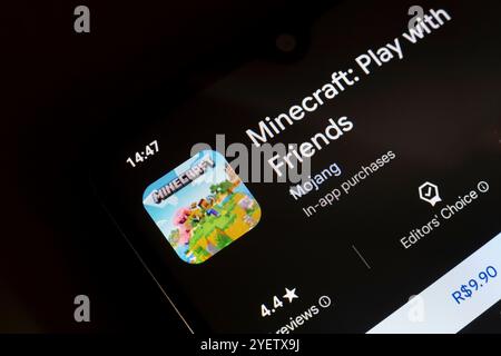 In this photo illustration, the Minecraft logo is displayed on a ...