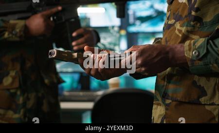 Military officers doing weapons maintenance in war room, ensuring ...