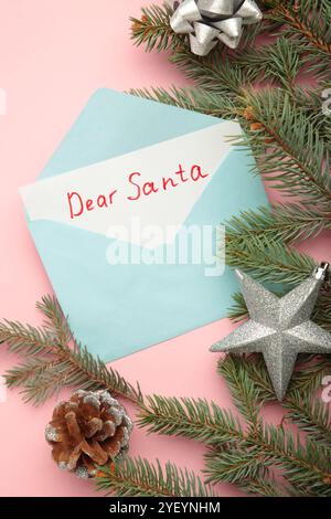 Dear Santa Claus wish card and letter on wooden desk with many colorful ...