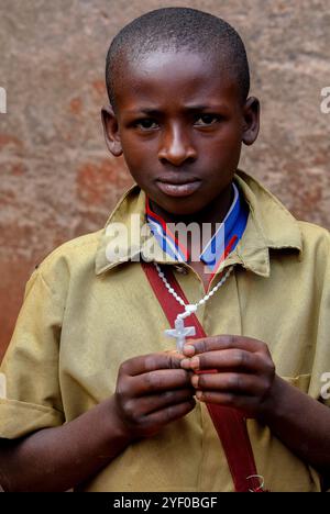 Boy with cross pendant in northern Rwanda Stock Photo - Alamy