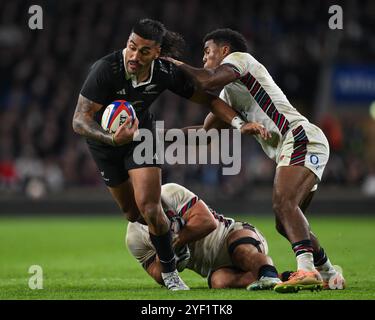 Rieko Ioane of New Zealand is tackled by Dan Edwards of Wales during ...