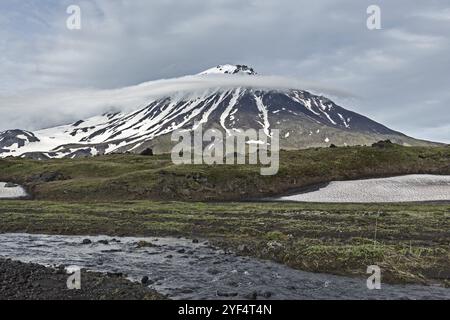 Cloudy volcanic mountain landscape overlooking the Atlantic Ocean in ...
