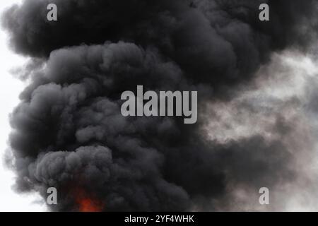 Smoke from a fire covers the sky over Omodos village, Cyprus, during a ...