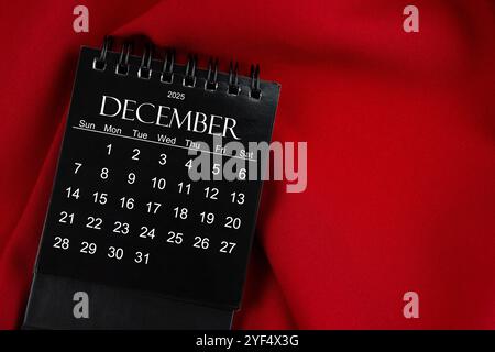 Black Calendar for December 2025. Desktop calendar on a black color ...