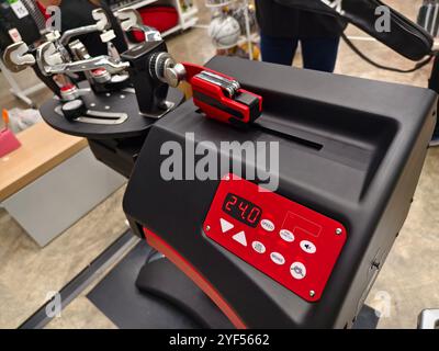 Strings a badminton racket on a racket stringing machine Stock Photo ...