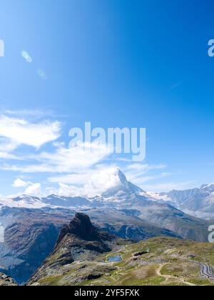 Amazing view of Riffelsee lake near Matterhorn peak mountain with many ...