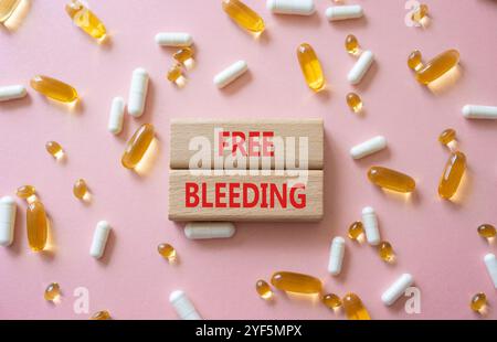Free bleeding symbol. Concept words Free bleeding on wooden blocks ...