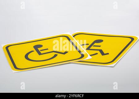 Studio shoot of yellow disability sign for placement on a vehicle ...