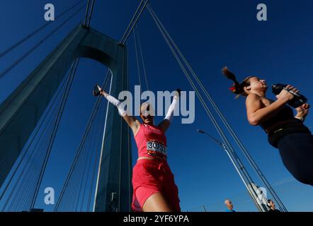 Runners cross over the span of Verrazzano-Narrows Bridge when they ...