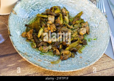 Lechecillas de ternasco. Roasted lamb gizzards served with stewed ...