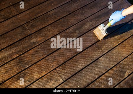 Painting the Wooden Flooring of a Terrace Stock Photo - Alamy