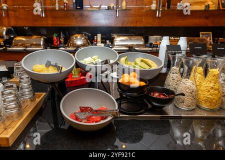 Elegant Breakfast Buffet with Fresh Cut Fruits and Variety of Cereals ...