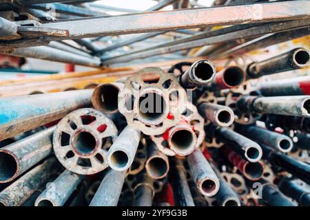 Stack of used worn galvanized steel scaffold tubes and pipes on ...