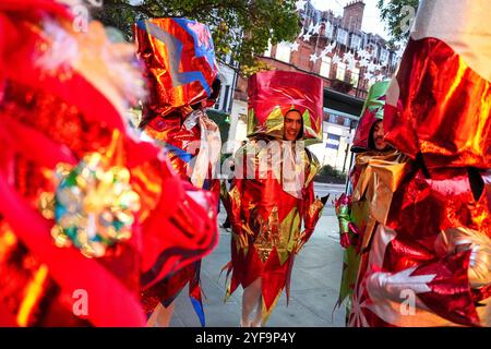 People dressed as Christmas Crackers pose for photographs during the ...
