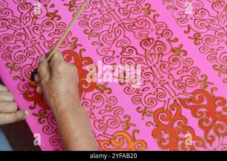 coloring process on Indonesian batik cloth Stock Photo - Alamy
