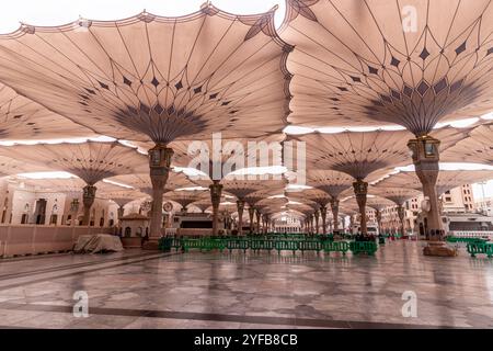 Shading umbrellas of the Prophet's Mosque in Al Haram area of Medina ...