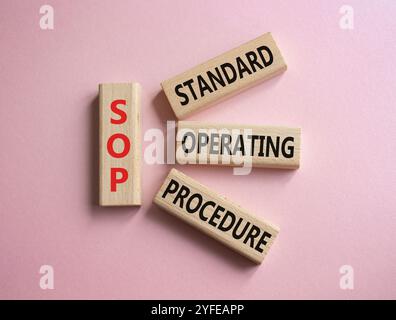SOP - Standard Operating Procedure symbol. Wooden blocks with word SOP ...