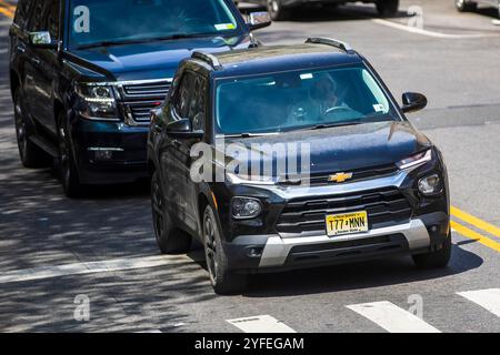 Black Chevrolet SUV driving on a city street in New York Stock Photo ...