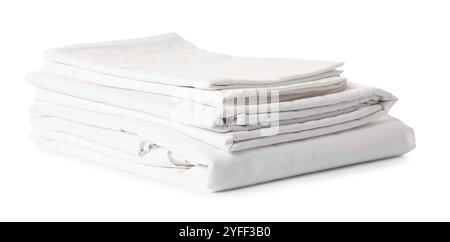 Stacked clean bed linens on white background Stock Photo - Alamy