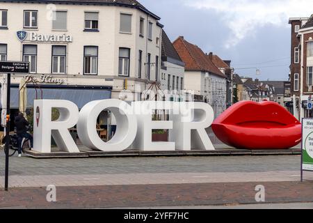 A welcoming sign of Roermond just after leaving the train station and ...