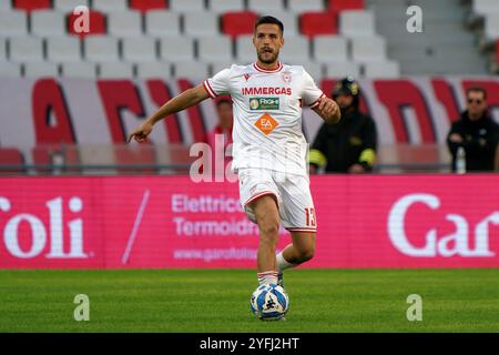 Andrea Meroni of SSC Bari in action against Gennaro Tutino of US ...