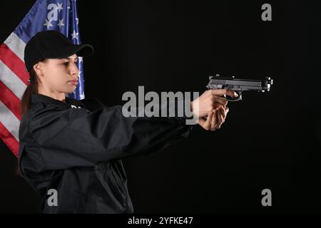 USA flag, pistol on a dark concrete background, place for your text ...