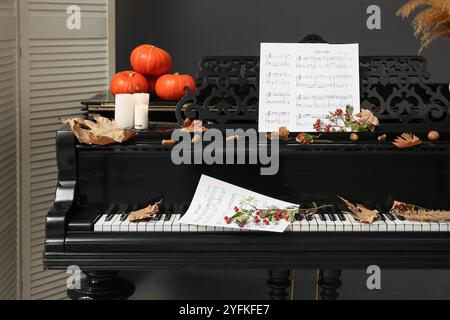 Piano with autumn decorations and musical notes, closeup Stock Photo ...