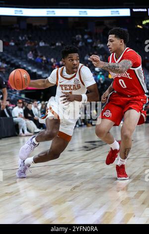Texas guard Julian Larry (1) drives to the basket against Texas A&M ...