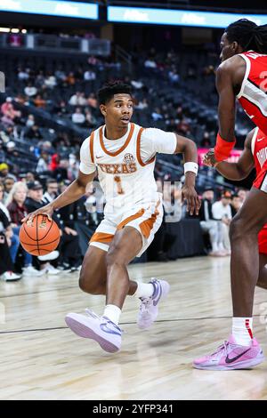 Texas guard Julian Larry (1) dribbles past Mississippi State guard Josh ...