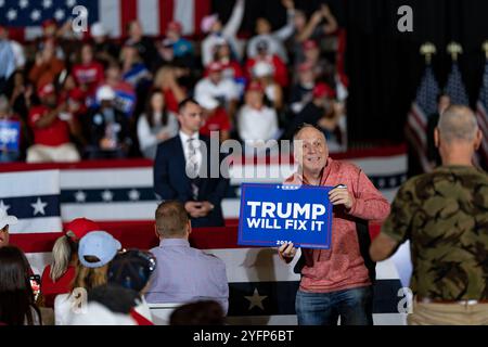 Vice President JD Vance, holding his daughter Mirabel, arrives at an ...