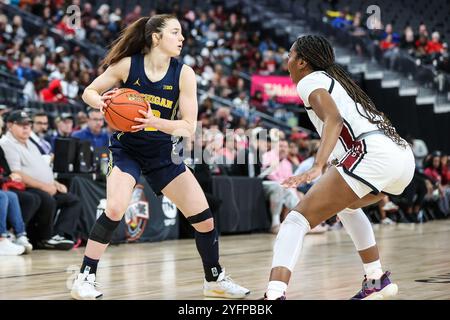 Michigan guard Syla Swords (12) passes the ball as Notre Dame guard ...