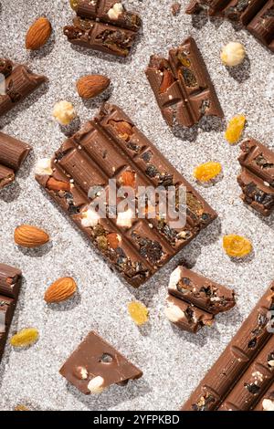 Nutty chocolate with hazelnuts on gray background Stock Photo - Alamy