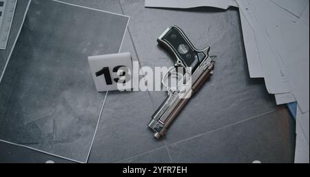 Bank robbery or murder case. Top view on murder weapon knife lying next ...