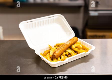 chips and a foot long sausage Stock Photo - Alamy