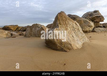 Sand beach among rocks in a summer morning in France Stock Photo - Alamy