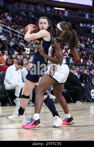 Michigan guard Syla Swords (12) dribbles against UCLA guard Kiki Rice ...