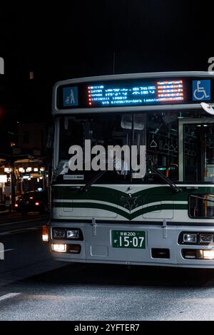 Bus in Kyoto by night Stock Photo - Alamy