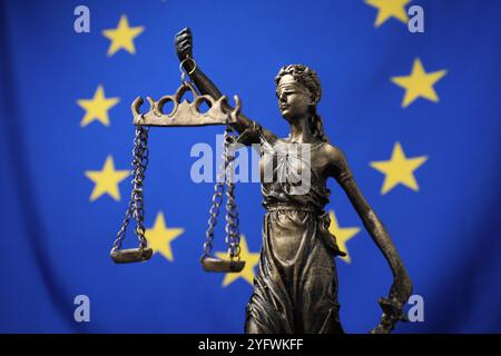 Figure of Lady Justice against European Union flag Stock Photo - Alamy